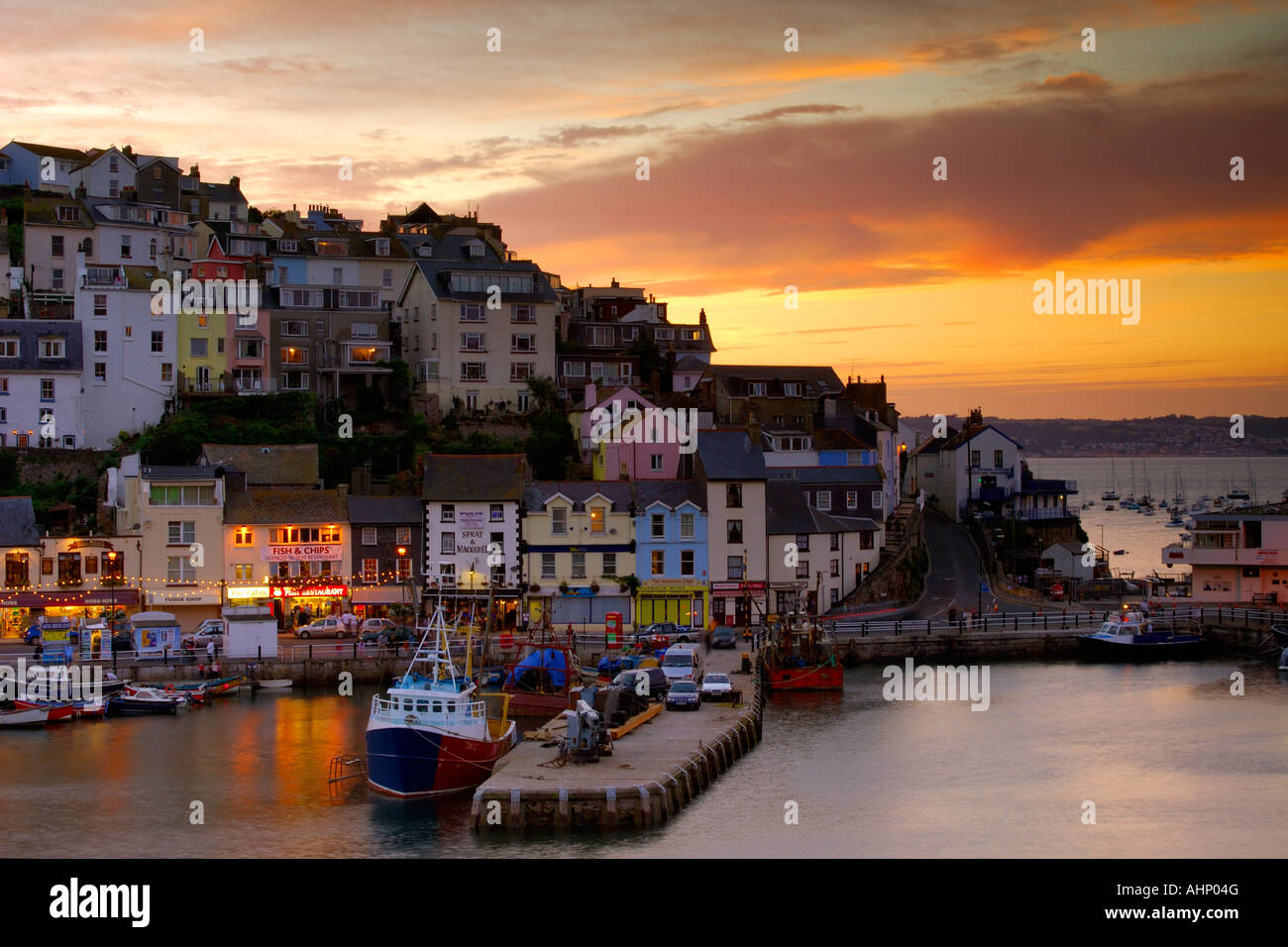 The small fishing town of Brixham on the South Devon coast at sunset ...