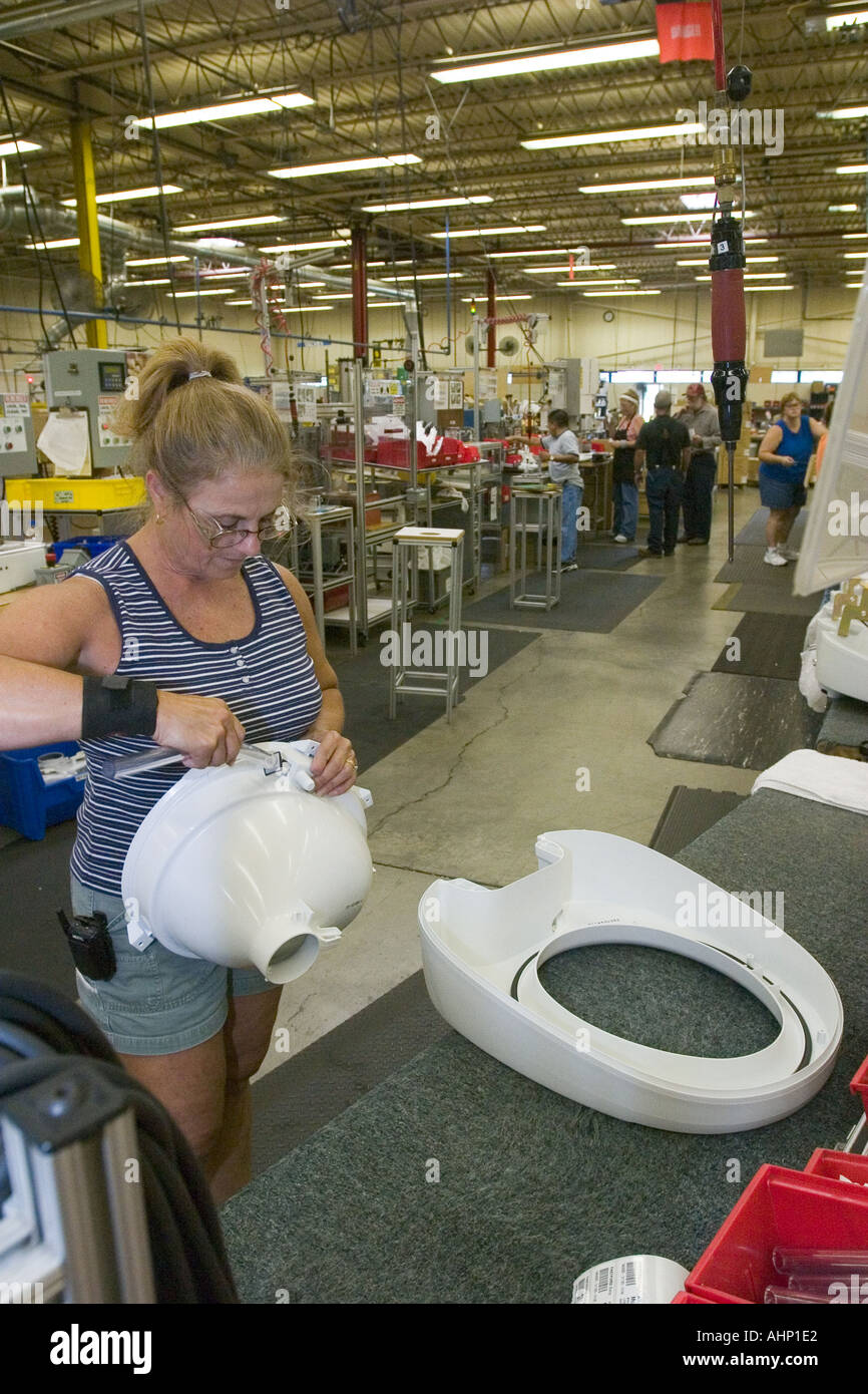Workers in factory making toilets for recreational vehicles Stock Photo ...