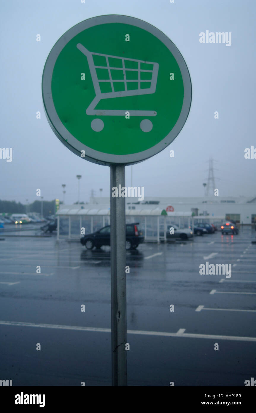 Green shopping trolley sign in Asda car park Edinburgh Stock Photo - Alamy