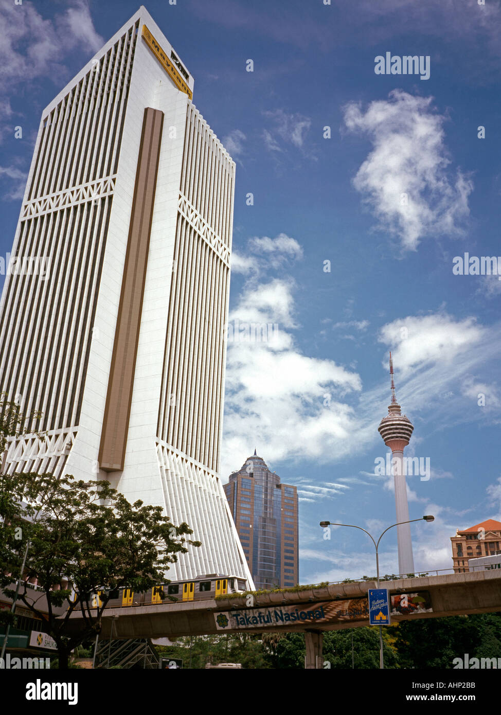 Malaysia Kuala Lumpur LRT train passing near Telecom Tower Stock Photo ...