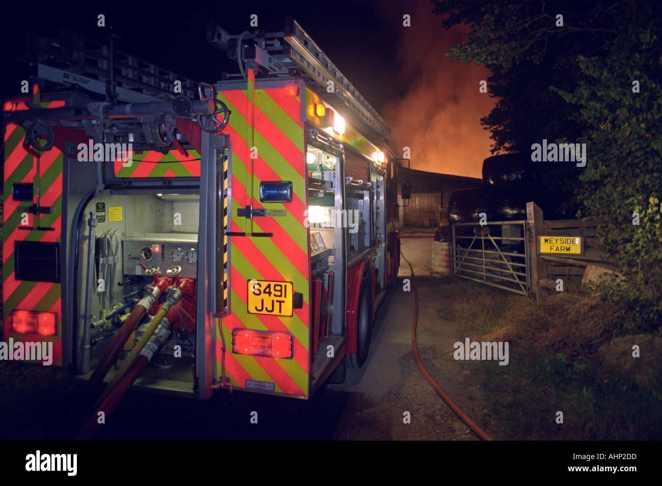 Fire engine at a countryside barn fire Stock Photo - Alamy