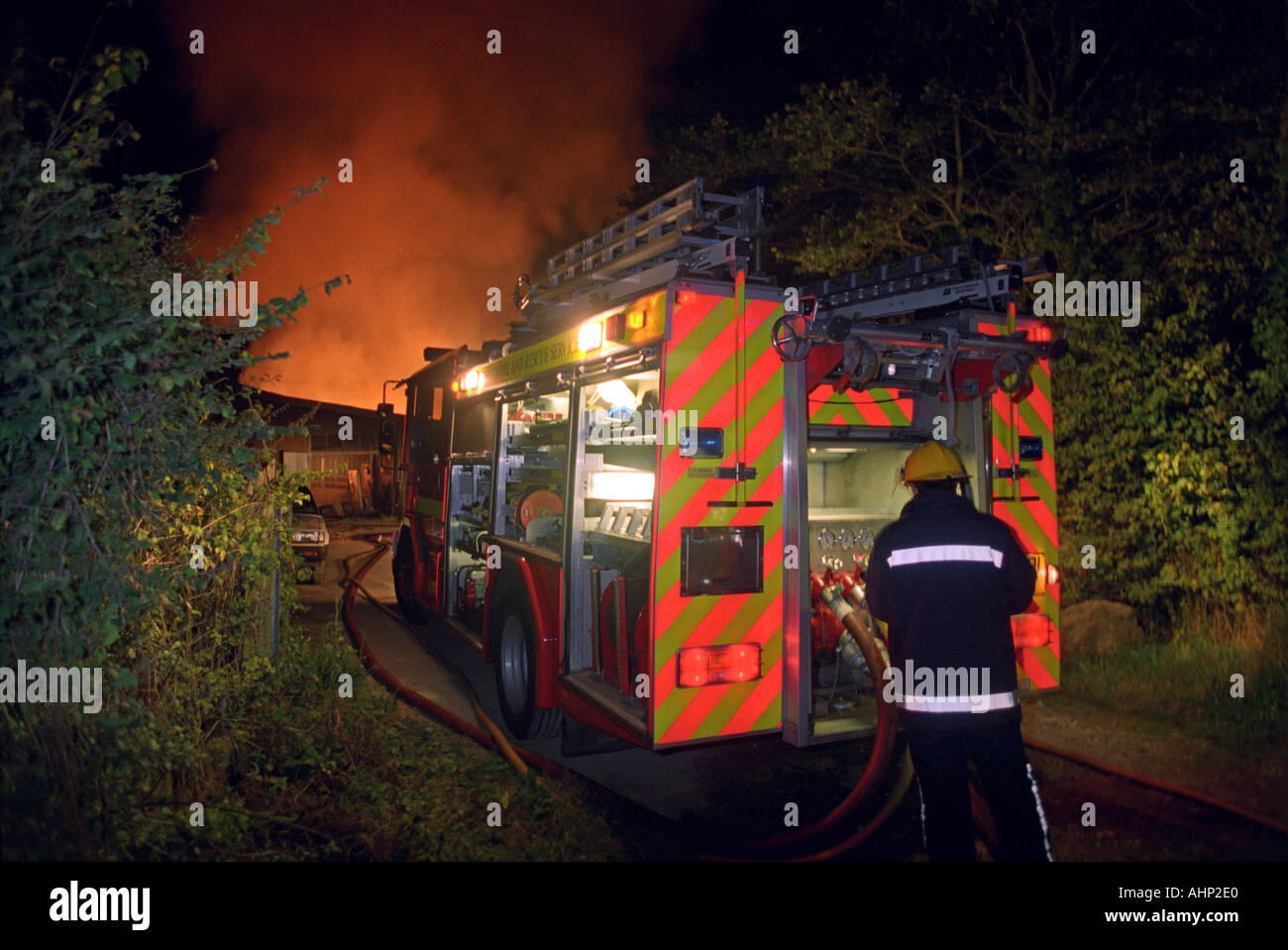 Fire engine at a countryside barn fire Stock Photo - Alamy