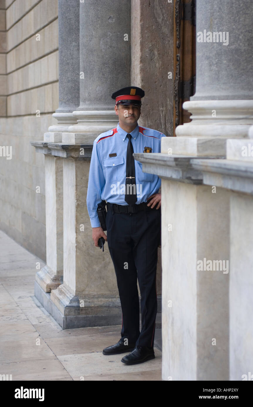 policeman standing guard in front of police station Barcelona Spain ...