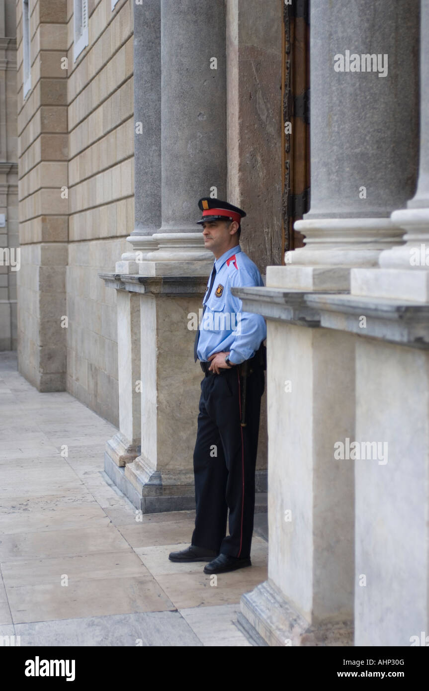policeman standing guard in front of police station Barcelona Cataluña ...