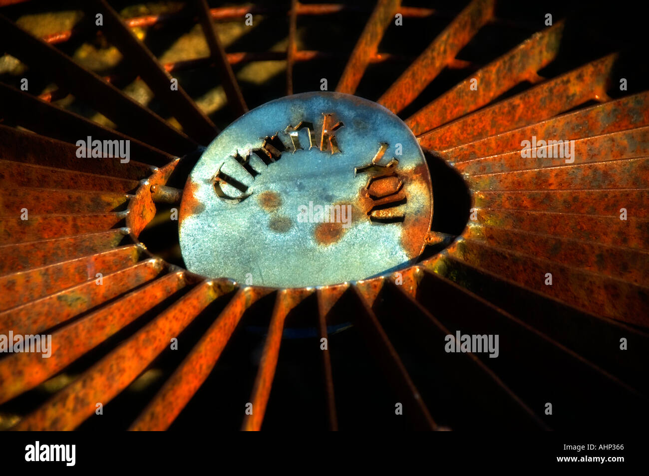 Rich rust coloured iron grate with thank you sign Stock Photo - Alamy