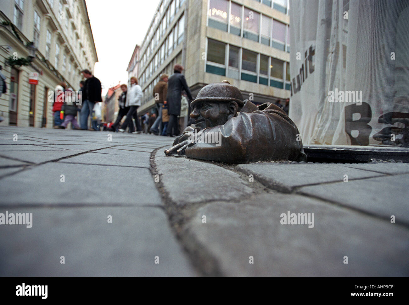 A statue of a man coming out of a drain in Bratislava Slovakia Stock ...
