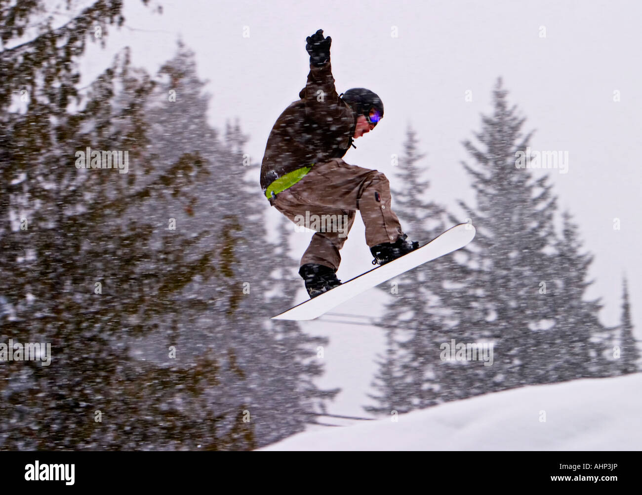 Jumping With A Snowboard Stock Photo - Alamy