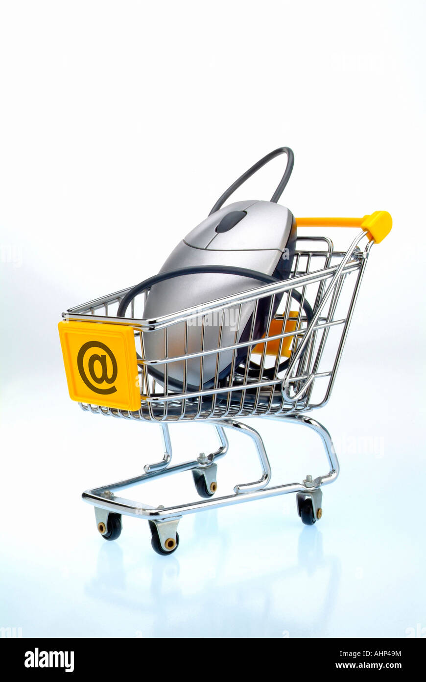 Shopping cart with @ on it and a computer mouse in it Stock Photo - Alamy