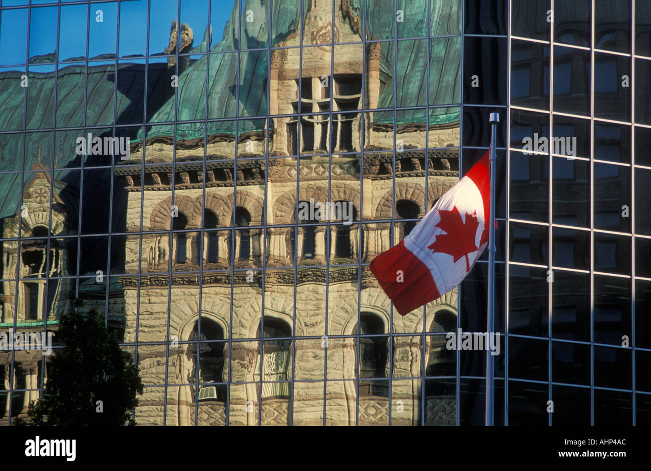 Old town hall Toronto reflected in modern skyscraper with Canadian flag ...