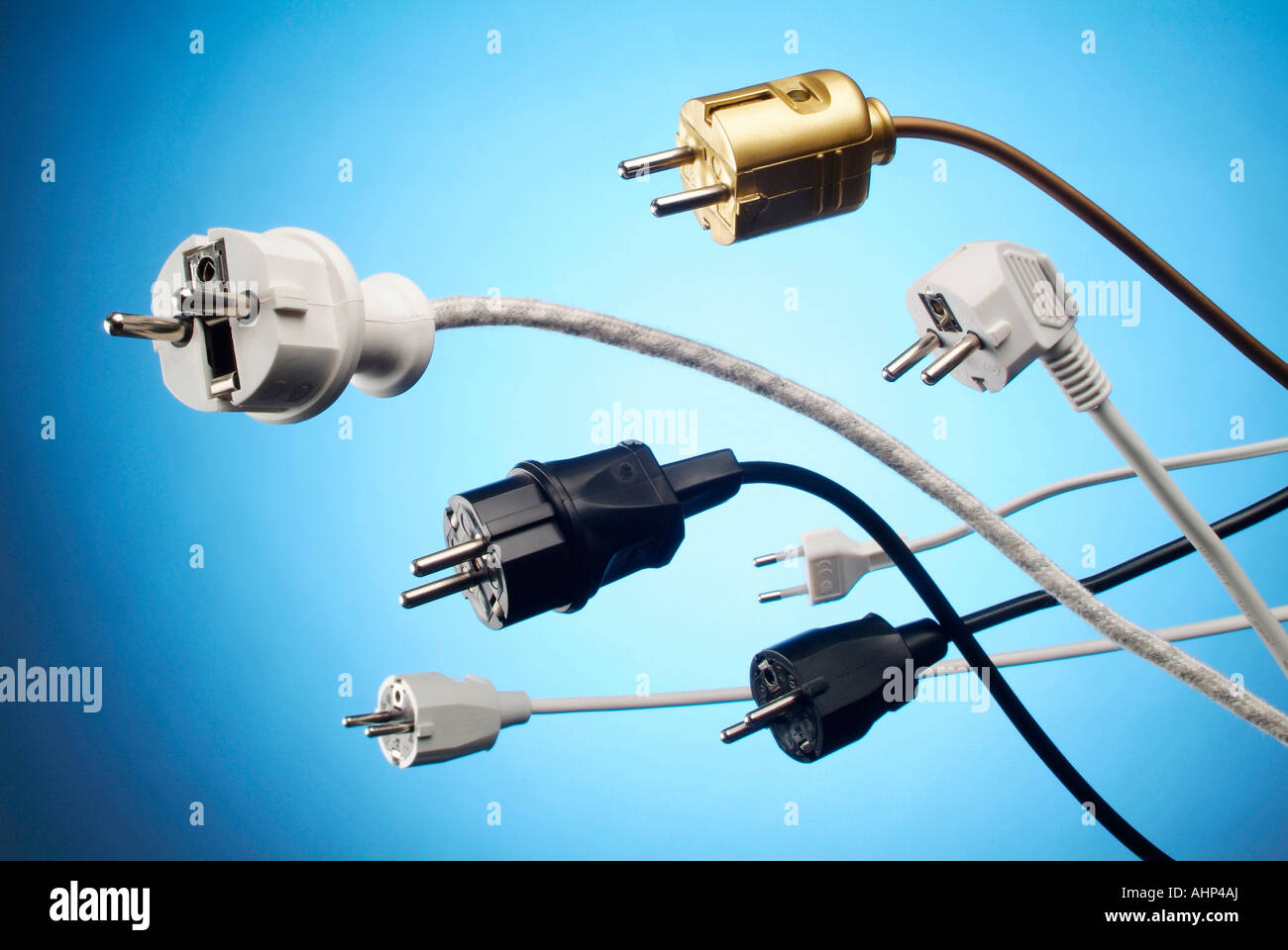 Plugs on blue background Stock Photo - Alamy