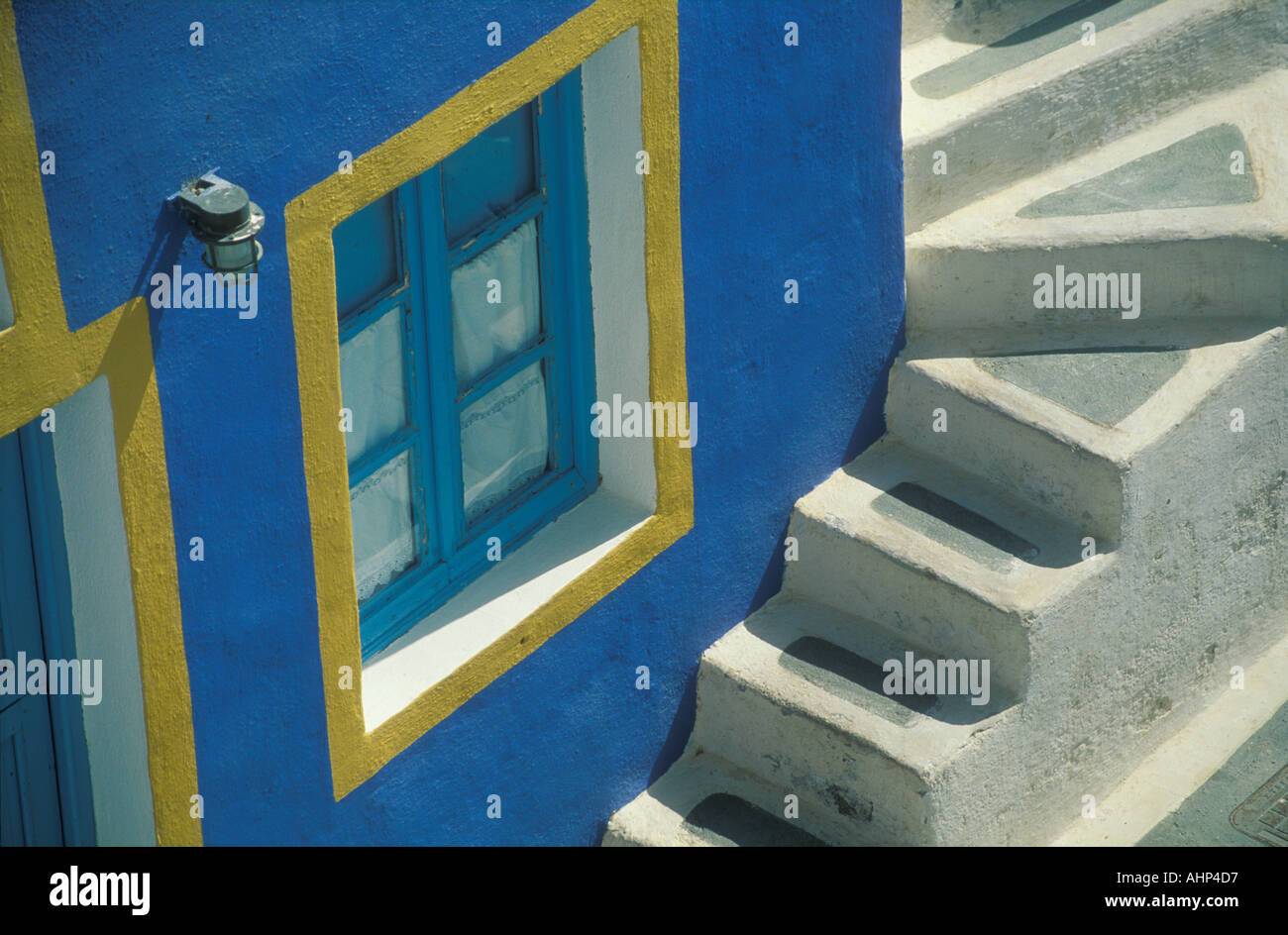 Blue villa walls yellow window frames and grey steps Oia santorini ...