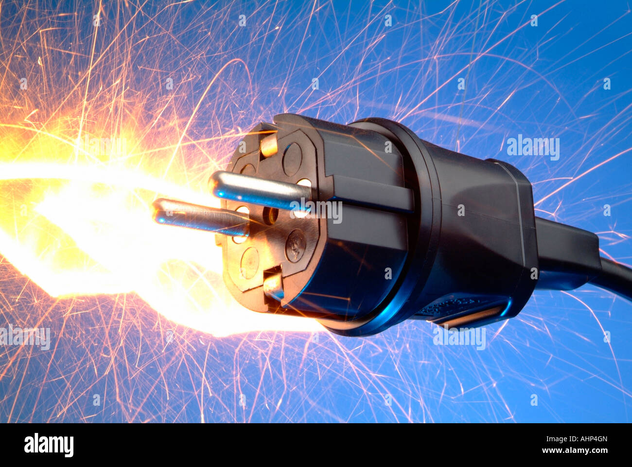 Black plug and electric discharge on blue background Stock Photo - Alamy