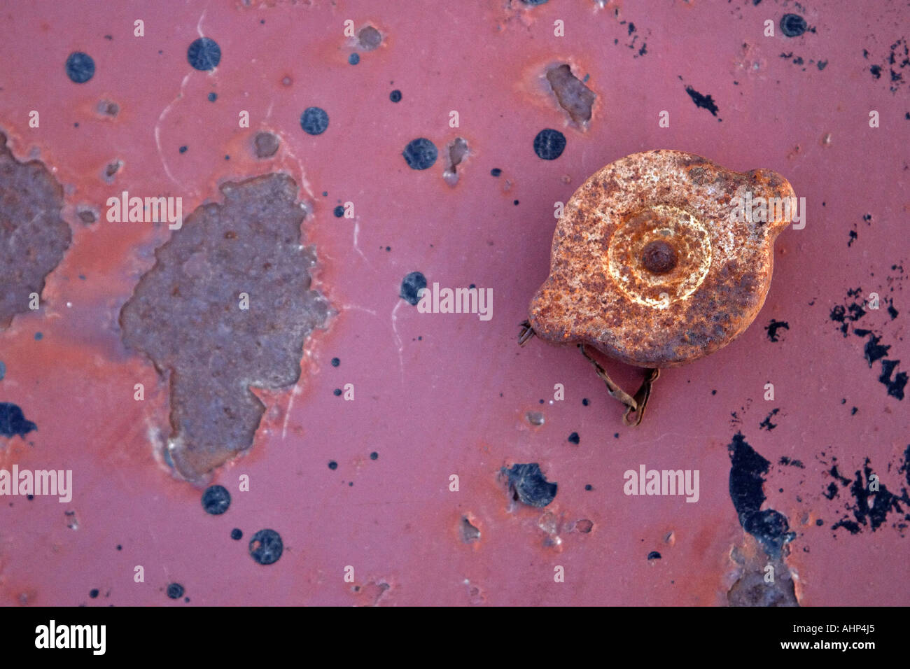 Rusted radiator cap on rusting red painted metal Stock Photo - Alamy