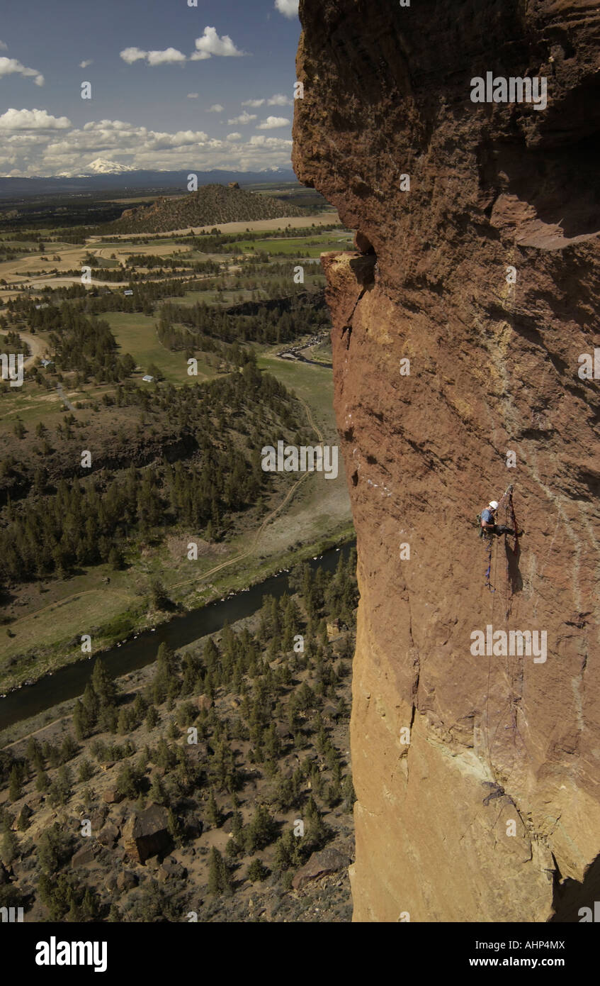 A man climbing the Monkey Face in Smith Rock state park near Terrebonne ...