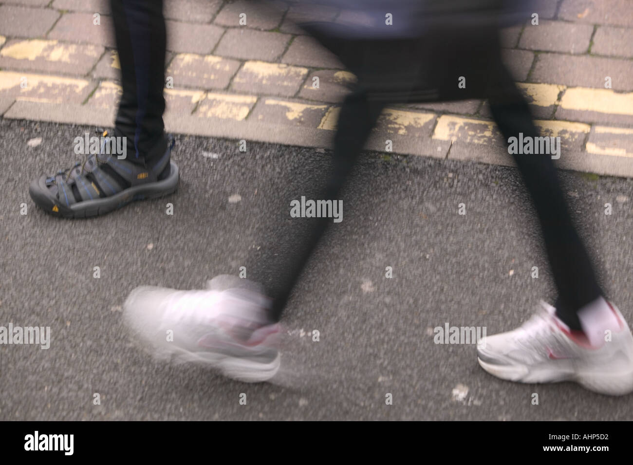 feet walking on the pavement Stock Photo - Alamy