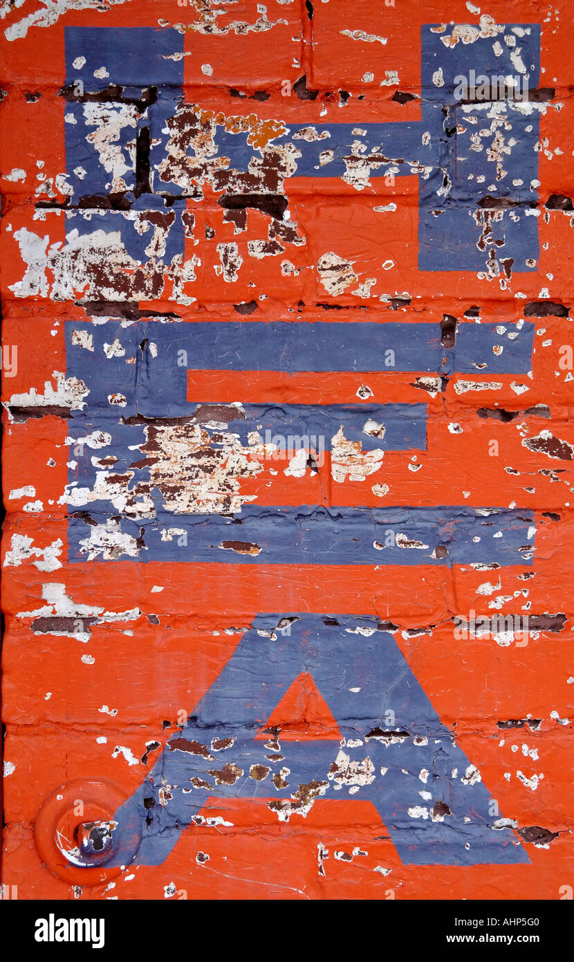 blue painted letters h. e. a on orange brick in Regina in scenic ...