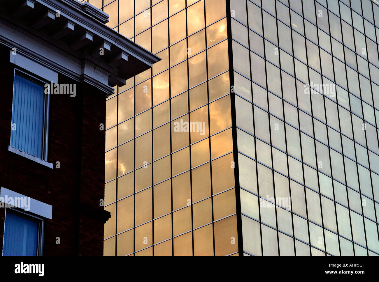 gold windows of sgi building beside older building in Regina in scenic ...