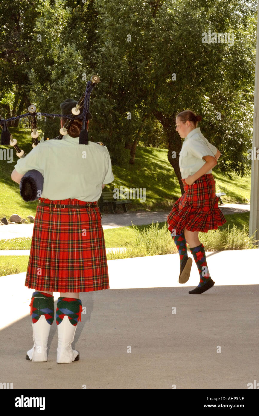 bagpipe player and Scottish dancer Stock Photo - Alamy