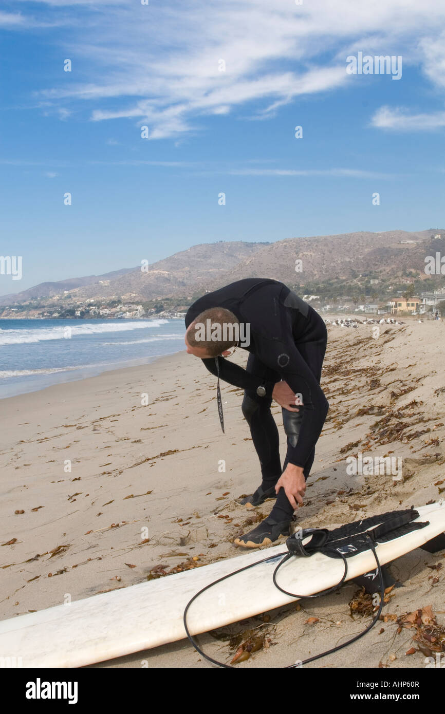 surfer stretches on the beach Stock Photo - Alamy