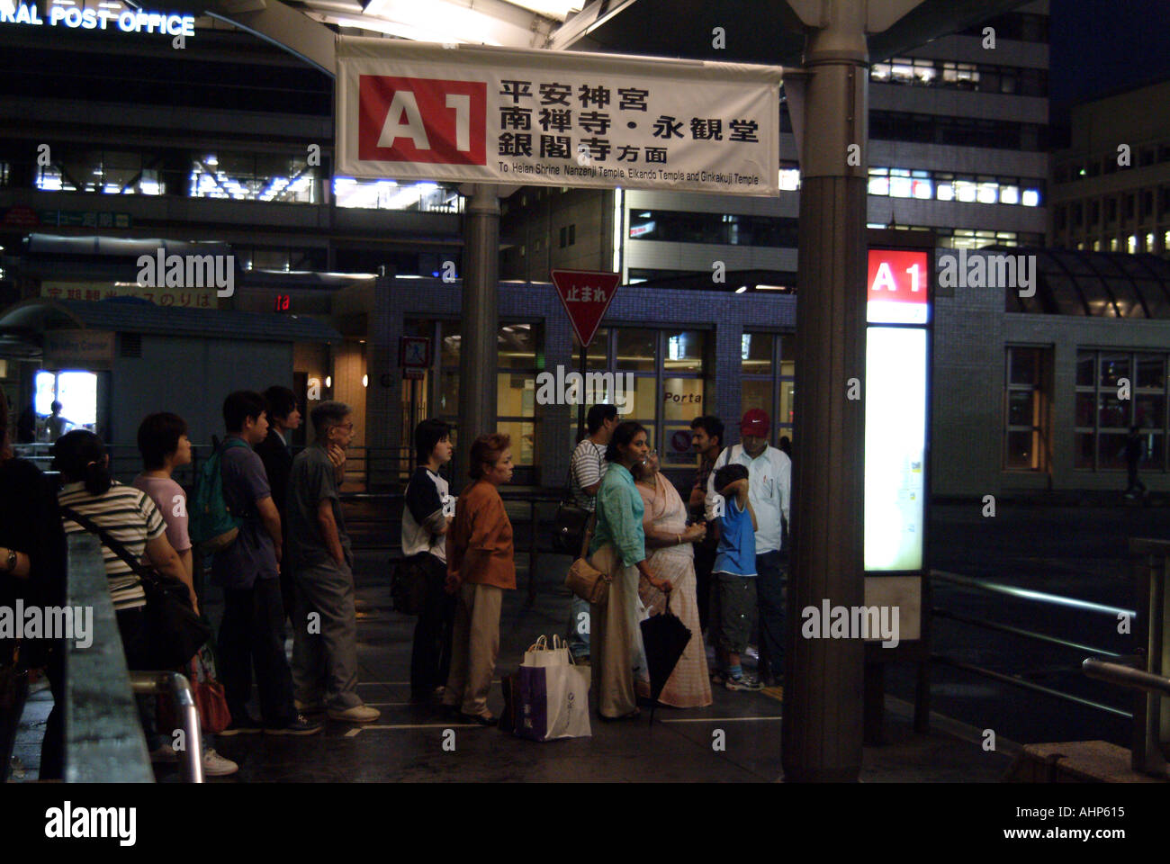 Passengers waiting at a bus stop Kyoto Station Japan Stock Photo - Alamy