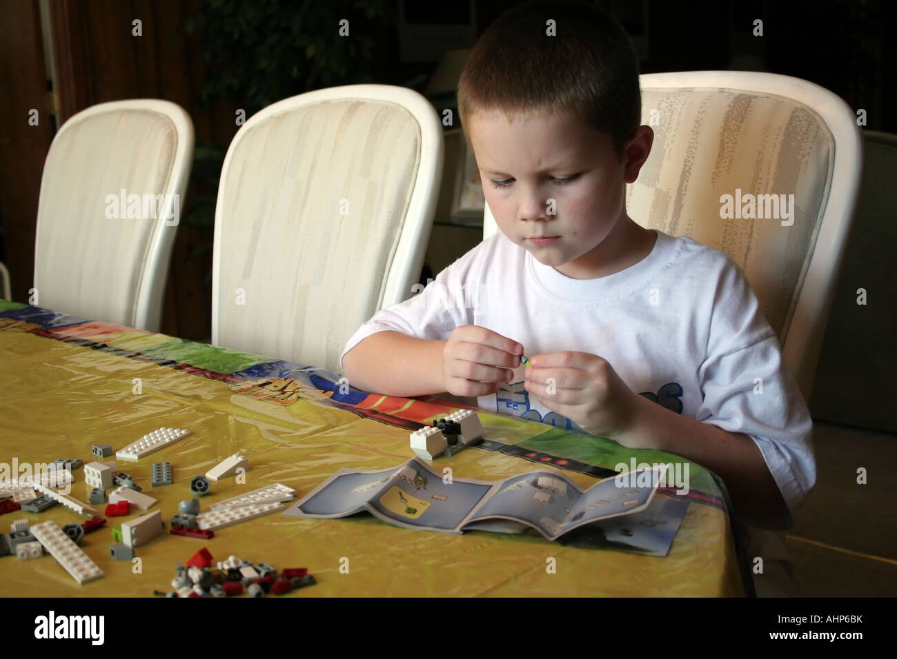 Young boy age 7 putting together Lego set Stock Photo - Alamy