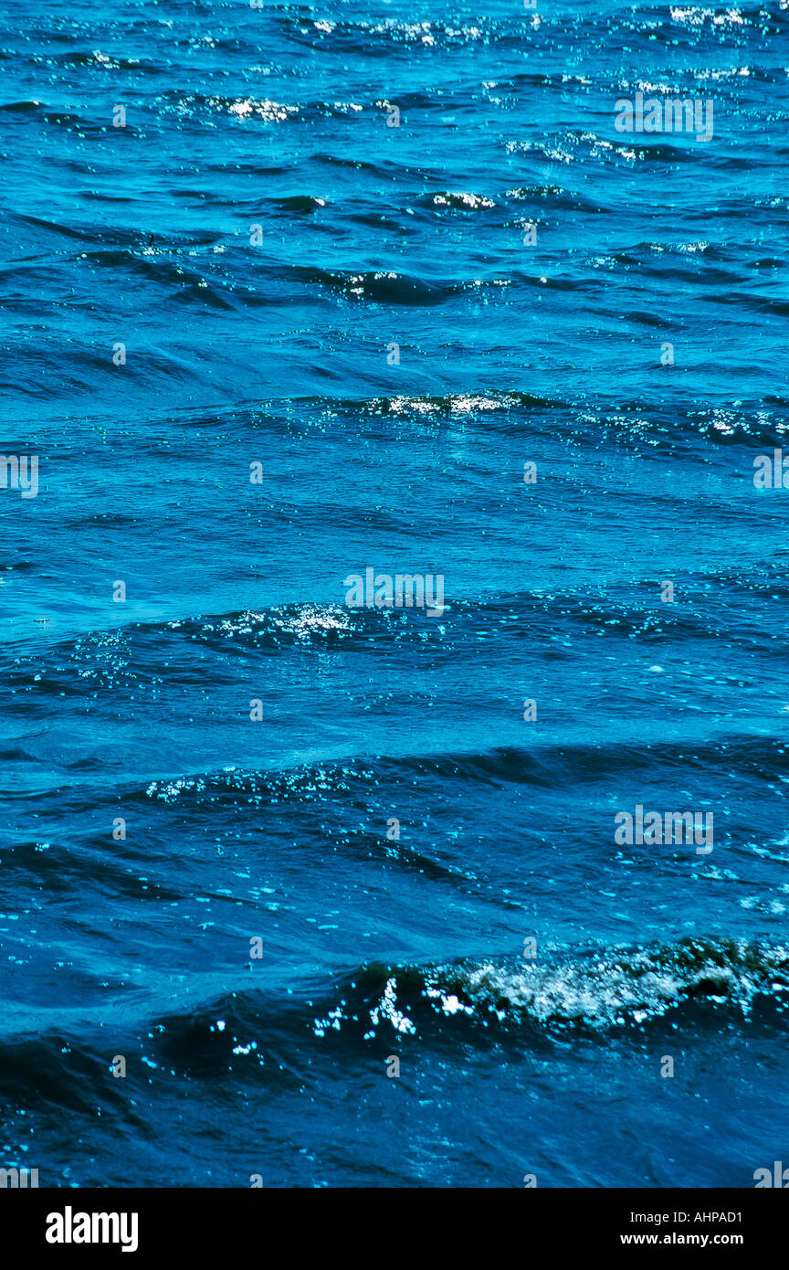 Small waves of blue water in ocean Stock Photo - Alamy