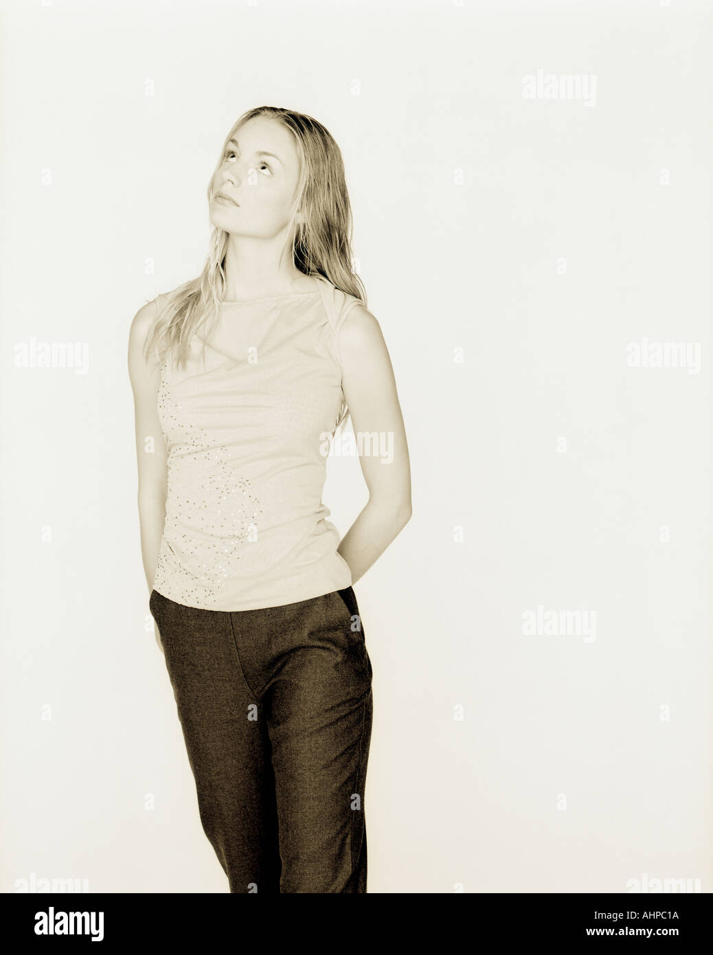 image of young woman three quarter length looking upward Stock Photo ...