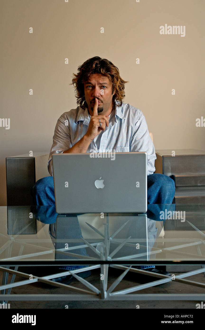 man sitting in front of laptop computer Stock Photo - Alamy