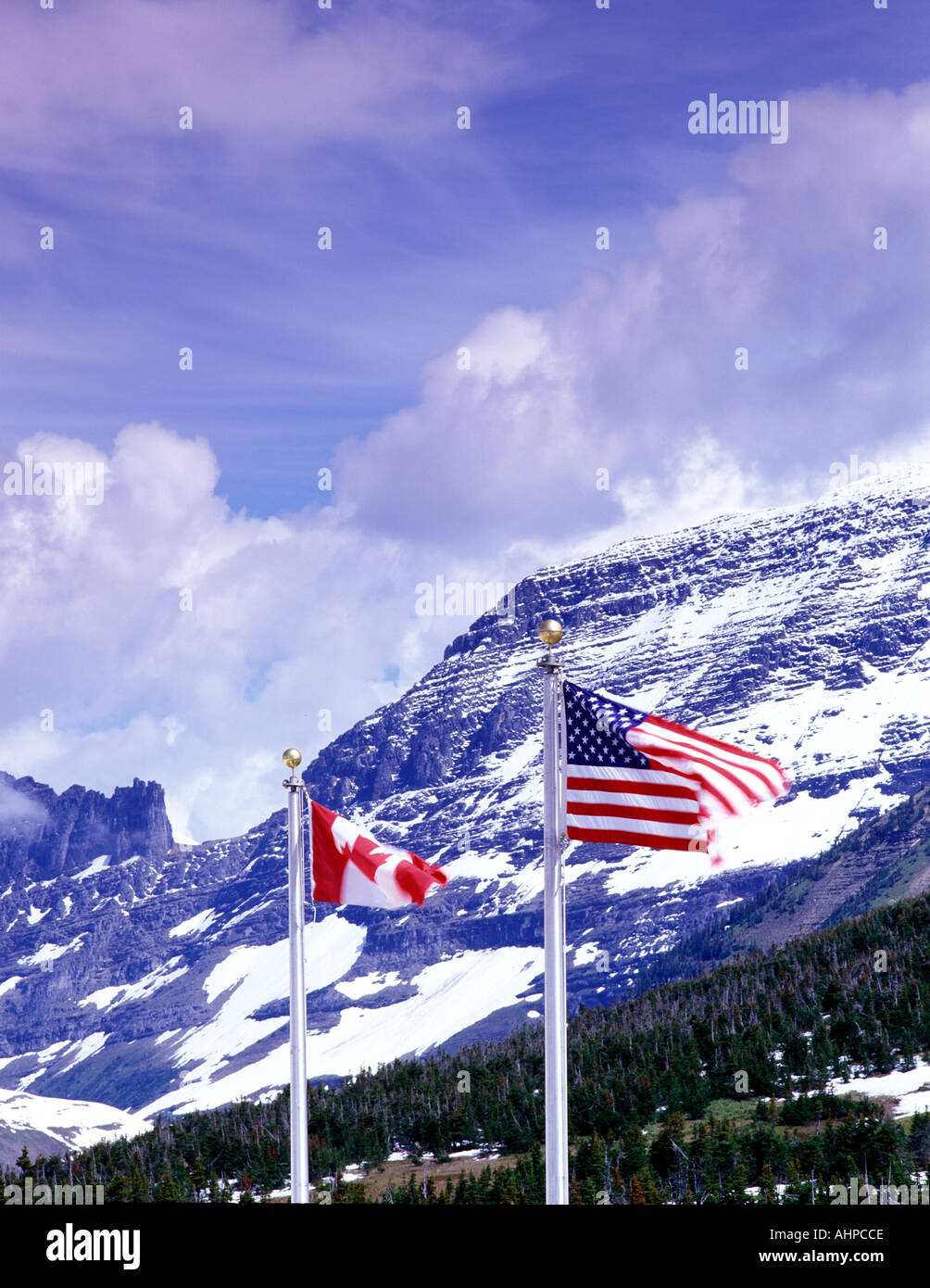 U S and Canada flags at visitors center at Logan Pass Glacier National ...