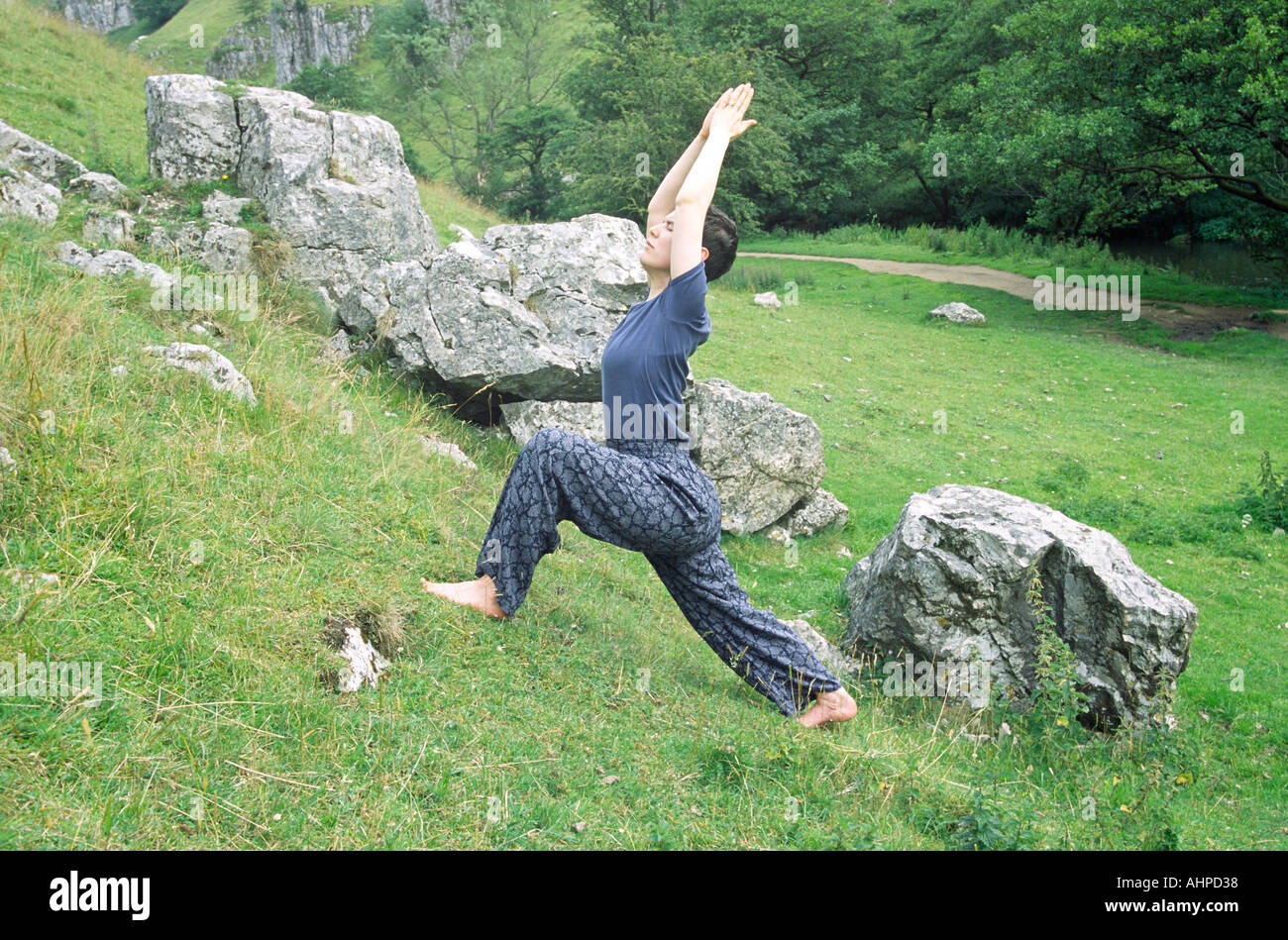 Young Woman Performing Warrior Pose in Dove Dale Derbyshire Stock Photo ...