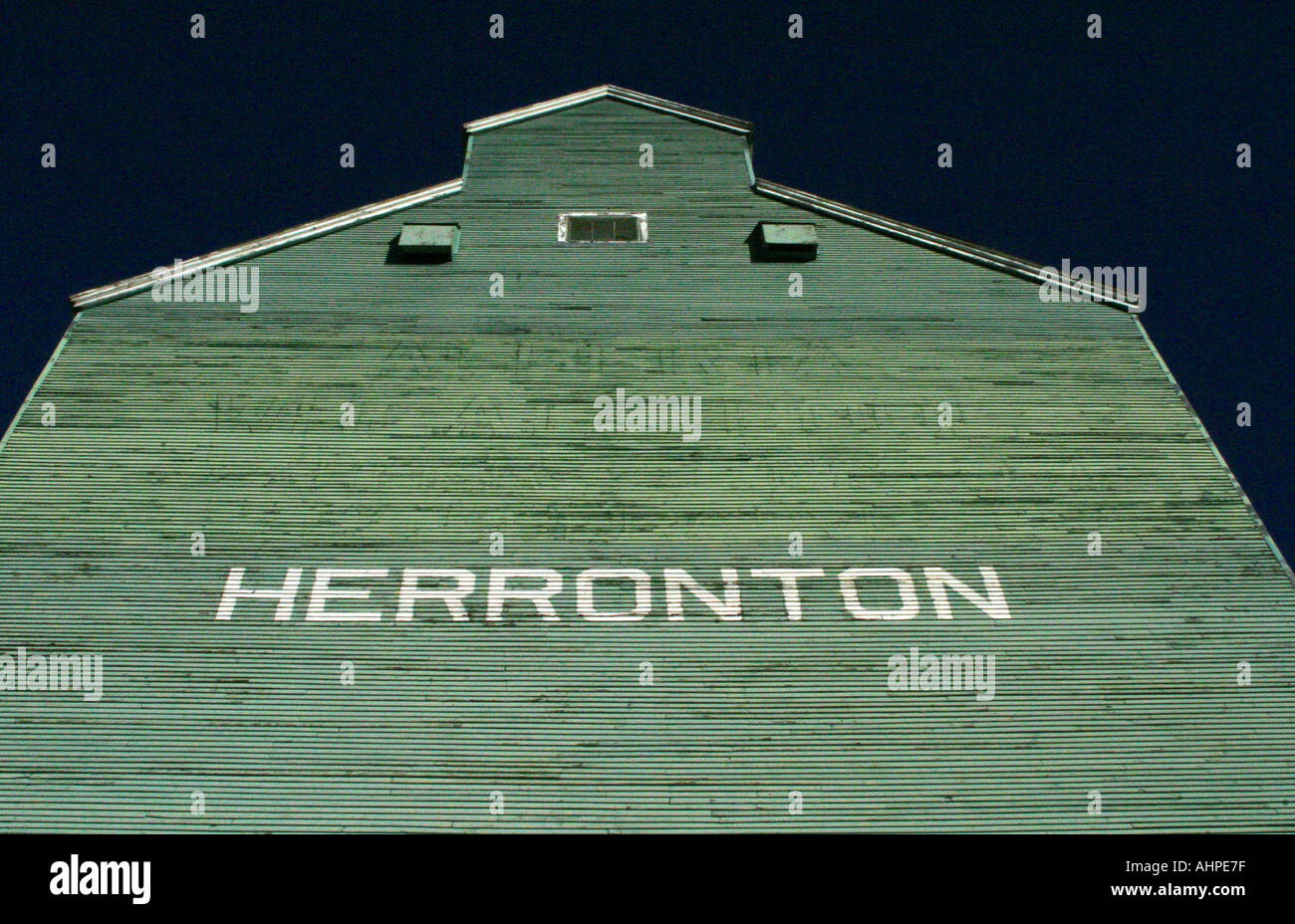 Horizontal Grain elevator trucks and train tracks Stock Photo - Alamy