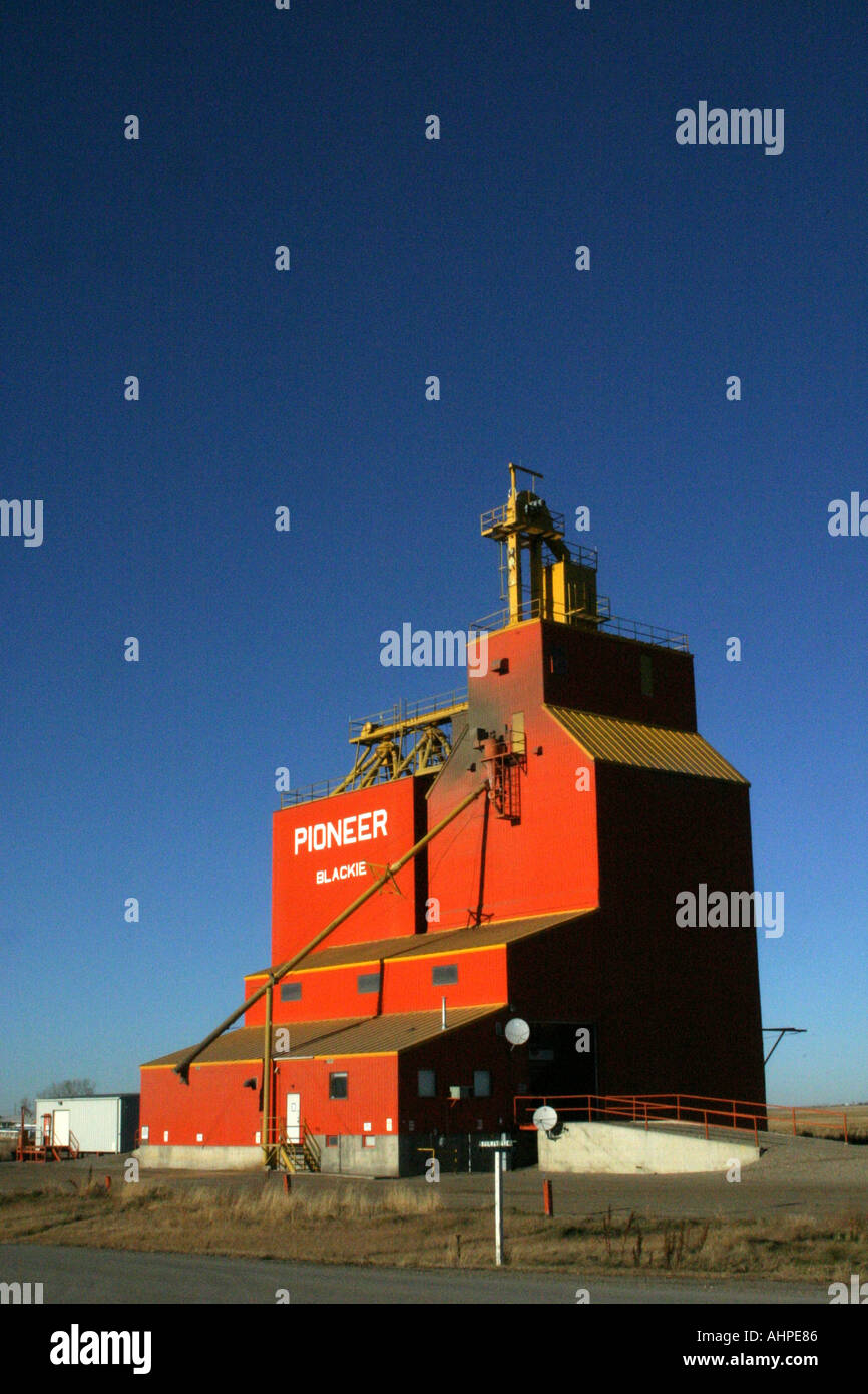 Vertical Grain elevator trucks and train tracks Stock Photo - Alamy