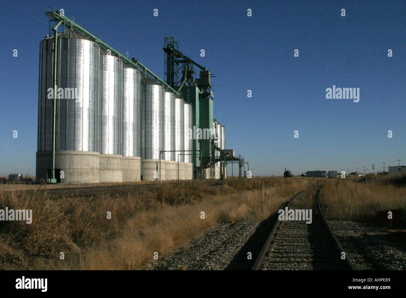 Grain elevator trucks and train tracks Horizontal Stock Photo - Alamy