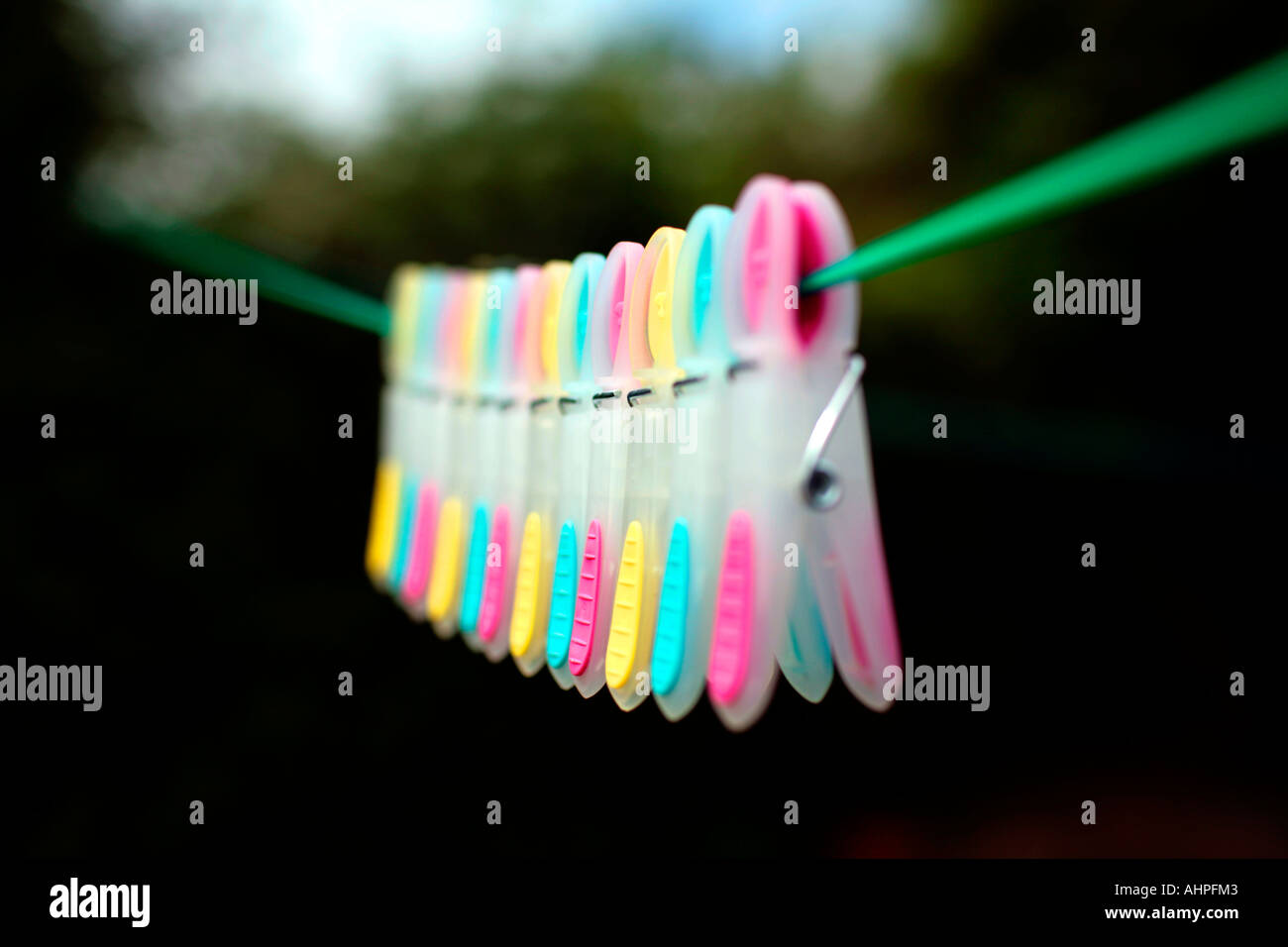 Pink plastic clothes pegs hi-res stock photography and images - Alamy