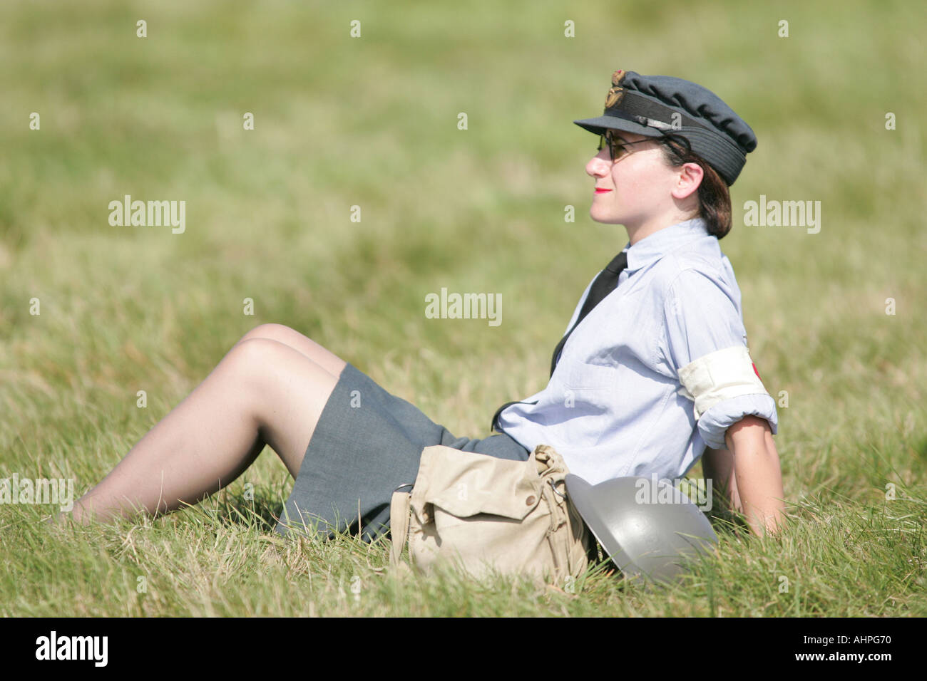 RAF at War nurse in period costume enjoys the sunshine during a WW2 ...