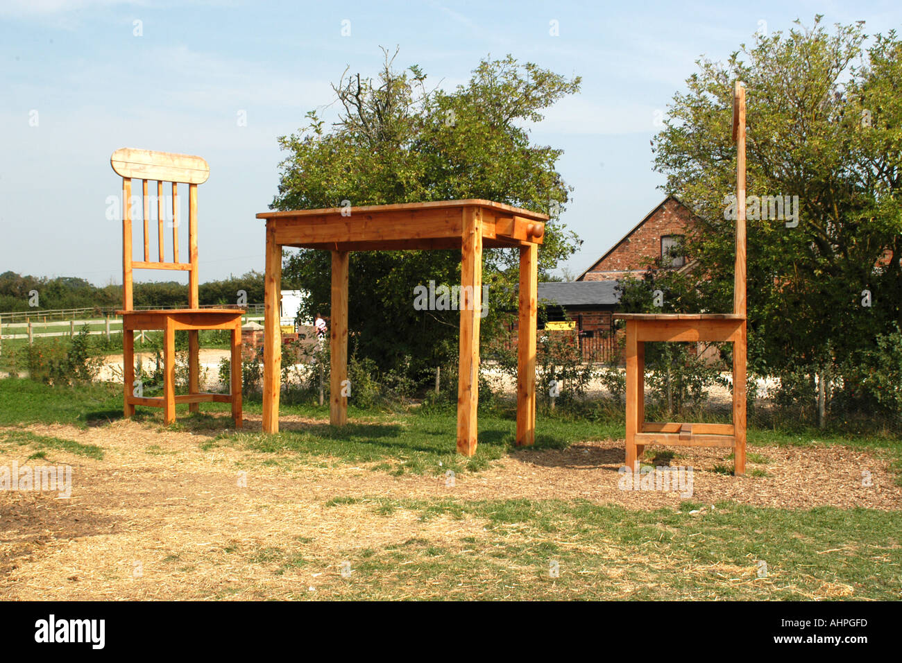 Giant table and two chairs Stock Photo - Alamy
