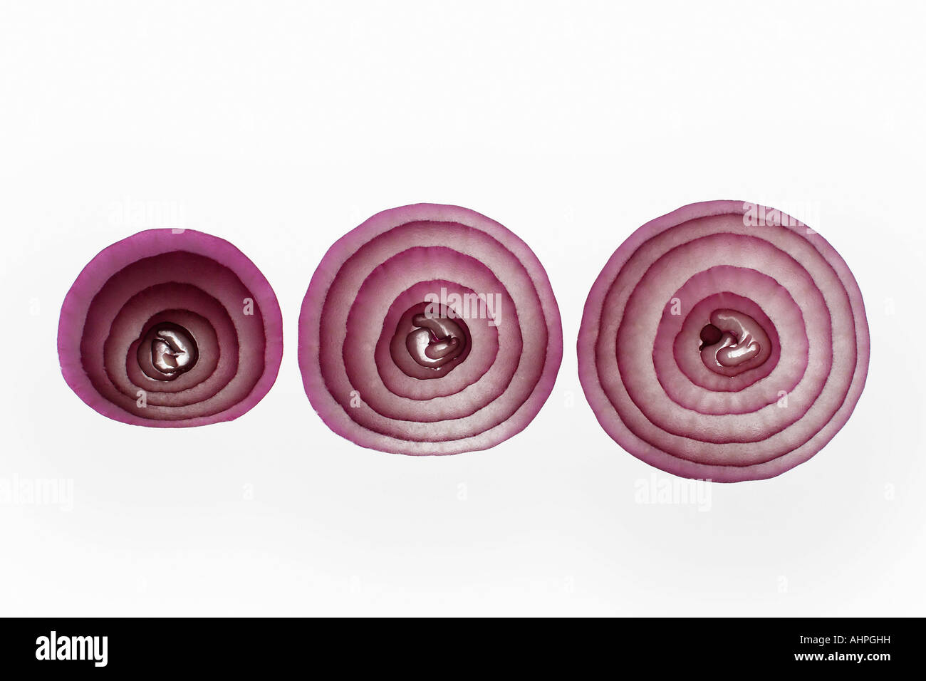 Three red onion slices against white background cross section Stock ...