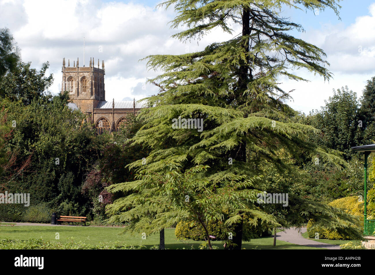 The Pageant gardens in Sherborne, Dorset with the Abbey tower in the ...