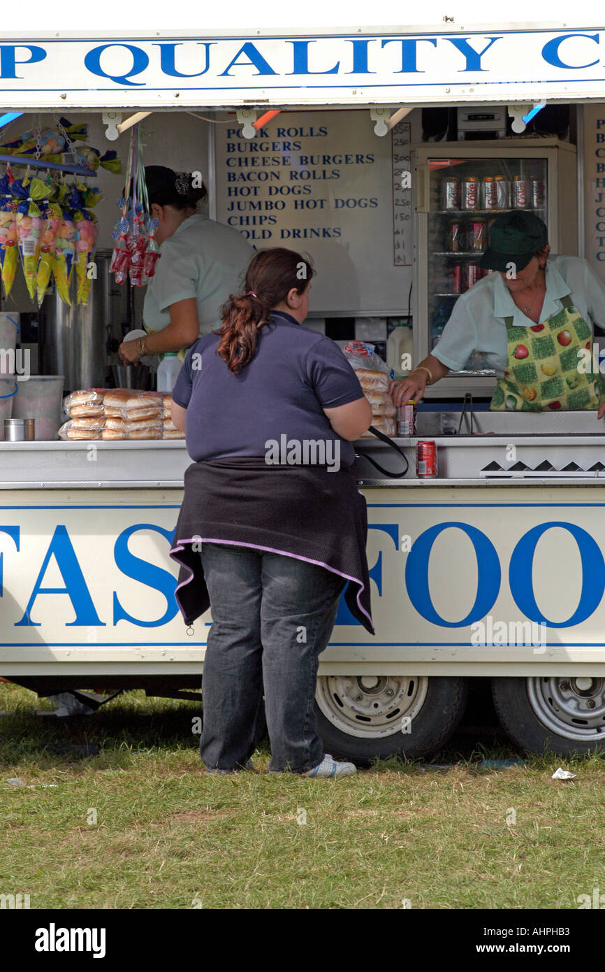 Fat woman ordering food from a mobile fast food catering vehicle Stock ...