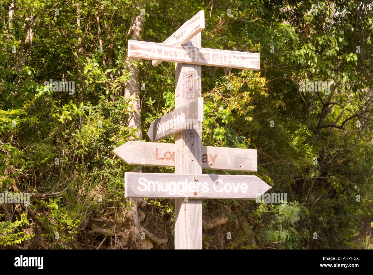 Sign pointing to Smugglers Cove on Caribbean Island Stock Photo - Alamy