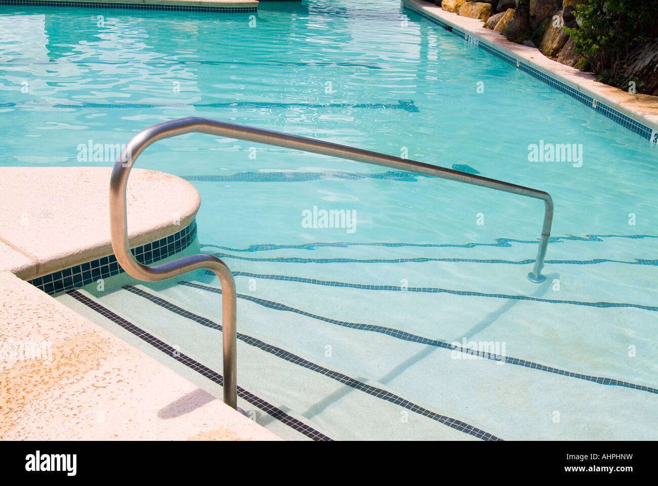 Steps into swimming pool Stock Photo - Alamy