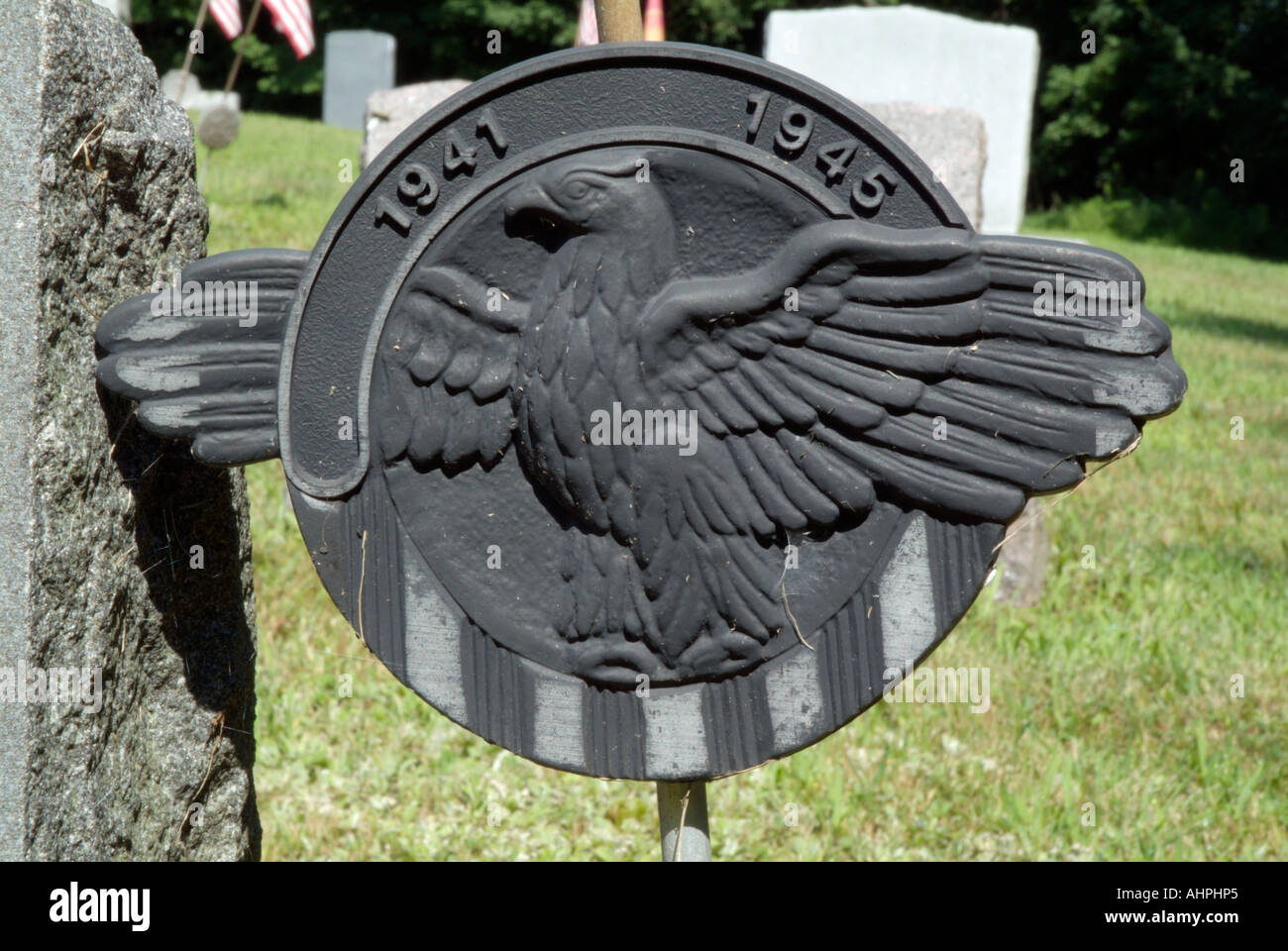 1941 1945 eagle flag holder next to a headstone in an scenic New ...
