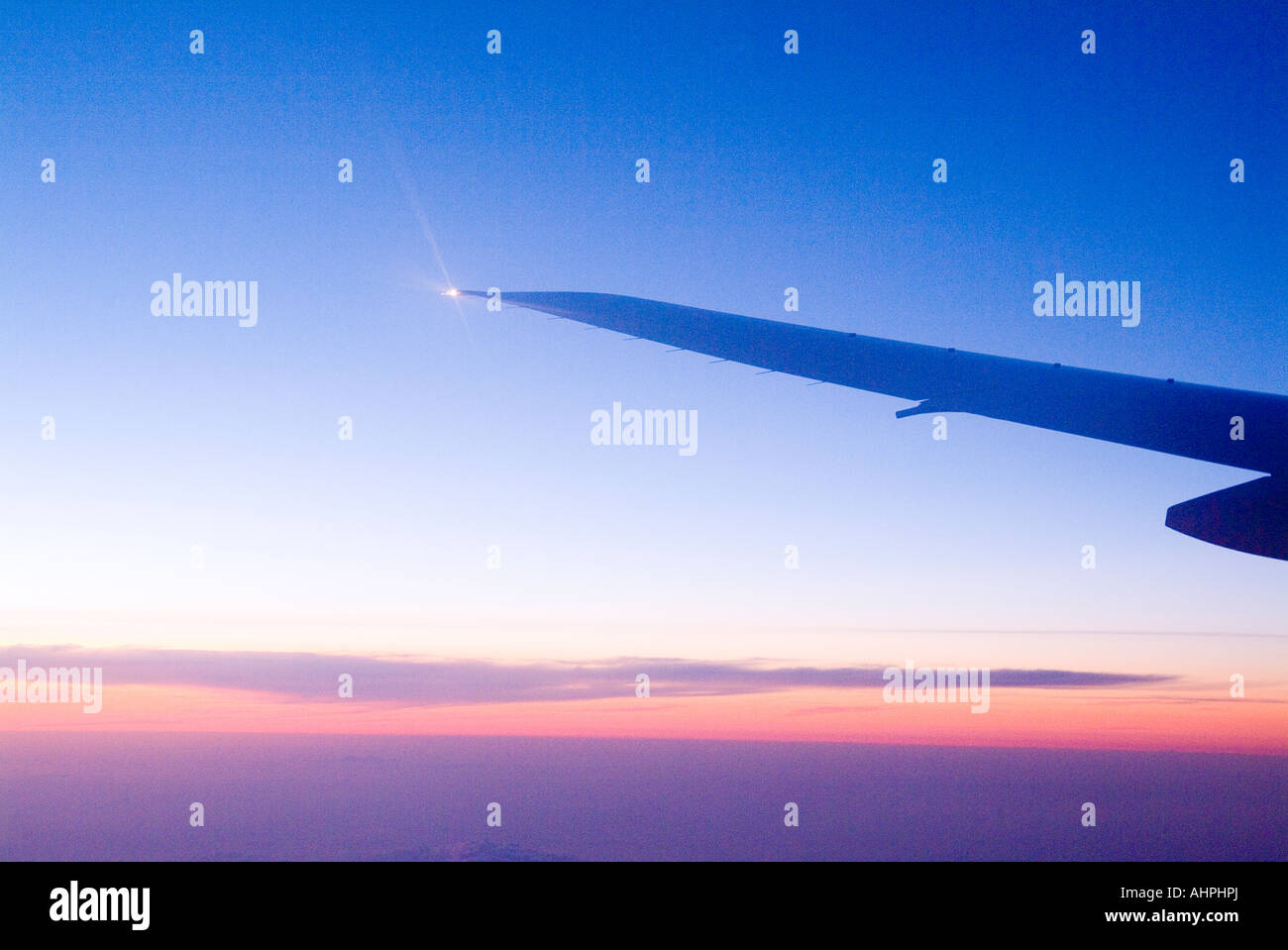 Airplane Wing at Sunset Stock Photo - Alamy