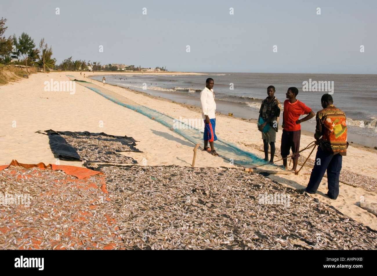 African man drying fish hi-res stock photography and images - Alamy