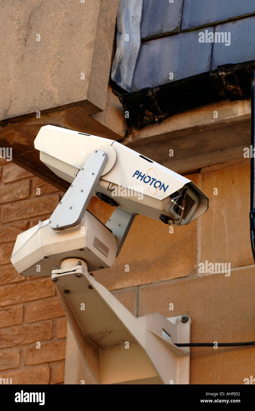 CCTV security camera seen here on the wall of a bank Stock Photo - Alamy