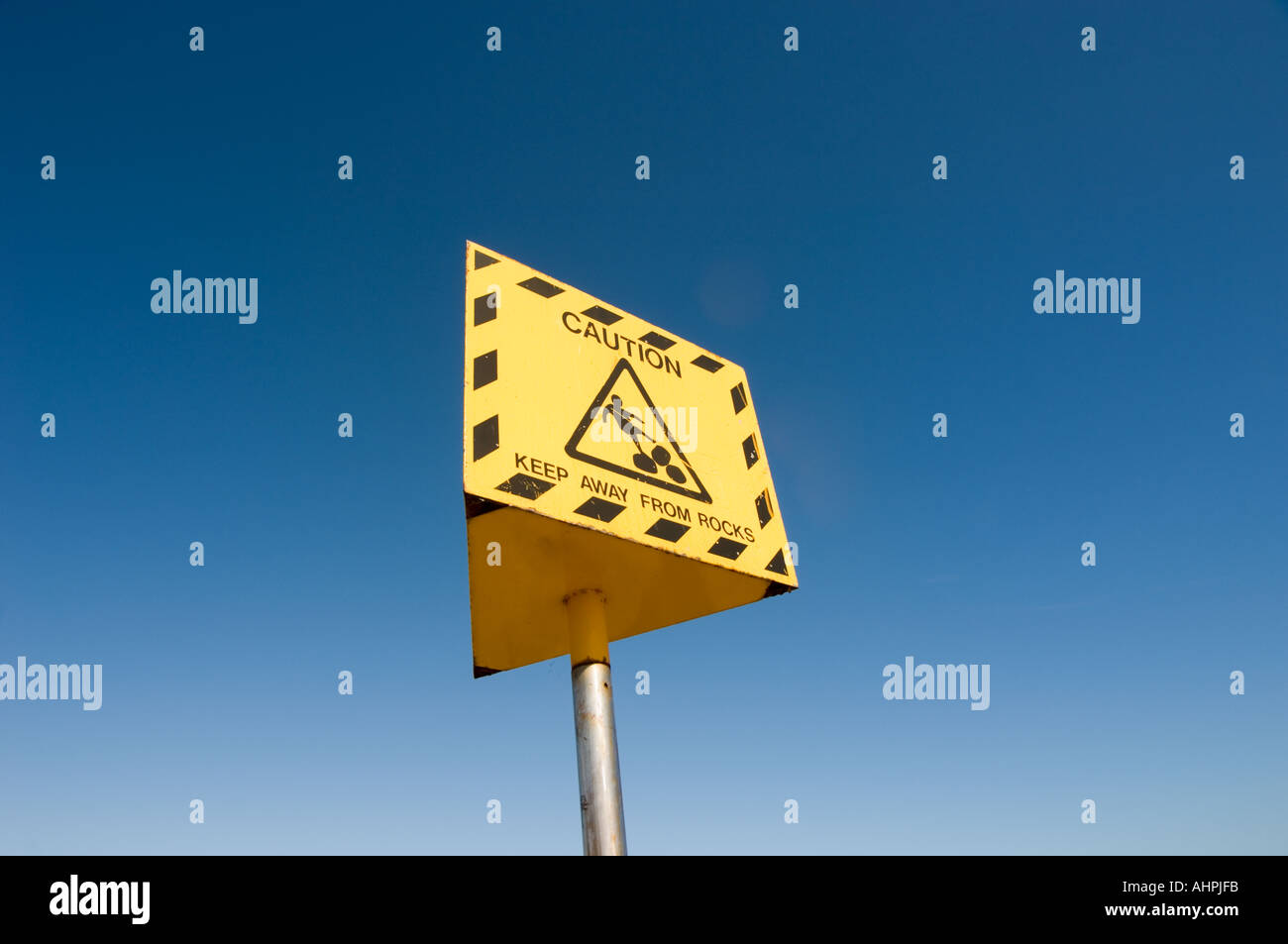 danger sign on the coast warning of dangerous rocks Stock Photo - Alamy