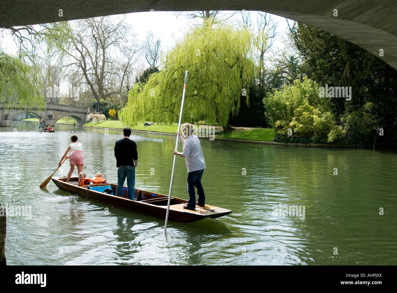 Punting under bridge, River Cam Stock Photo - Alamy