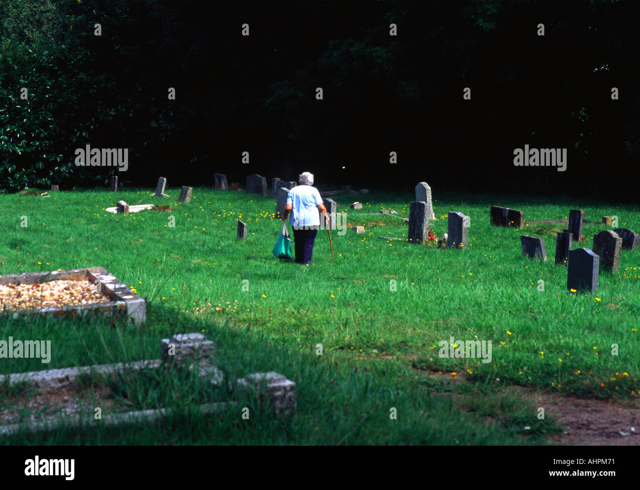 Woman in graveyard Kent England Stock Photo - Alamy