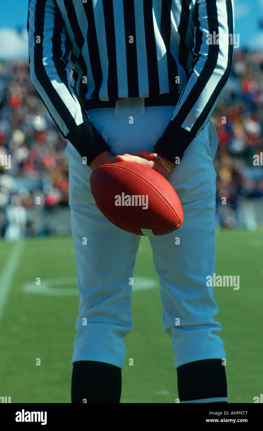 Referee holding a football behind his back West Point New York Stock ...