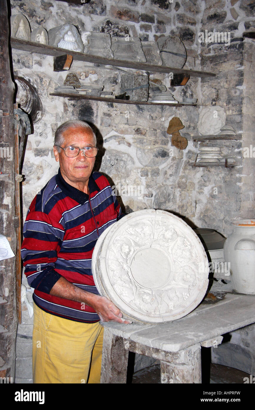 Ceramic artist showing one of his prize plates,Castelli Abuzzo Italy ...